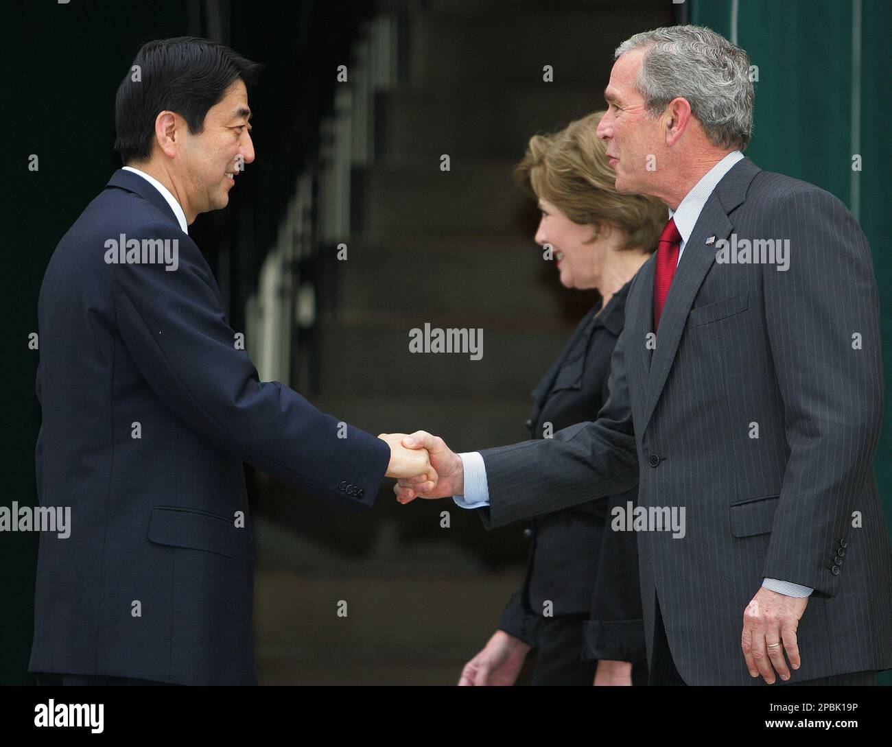 U.S. President Bush, right, shakes hands with Japanese Prime Minister ...