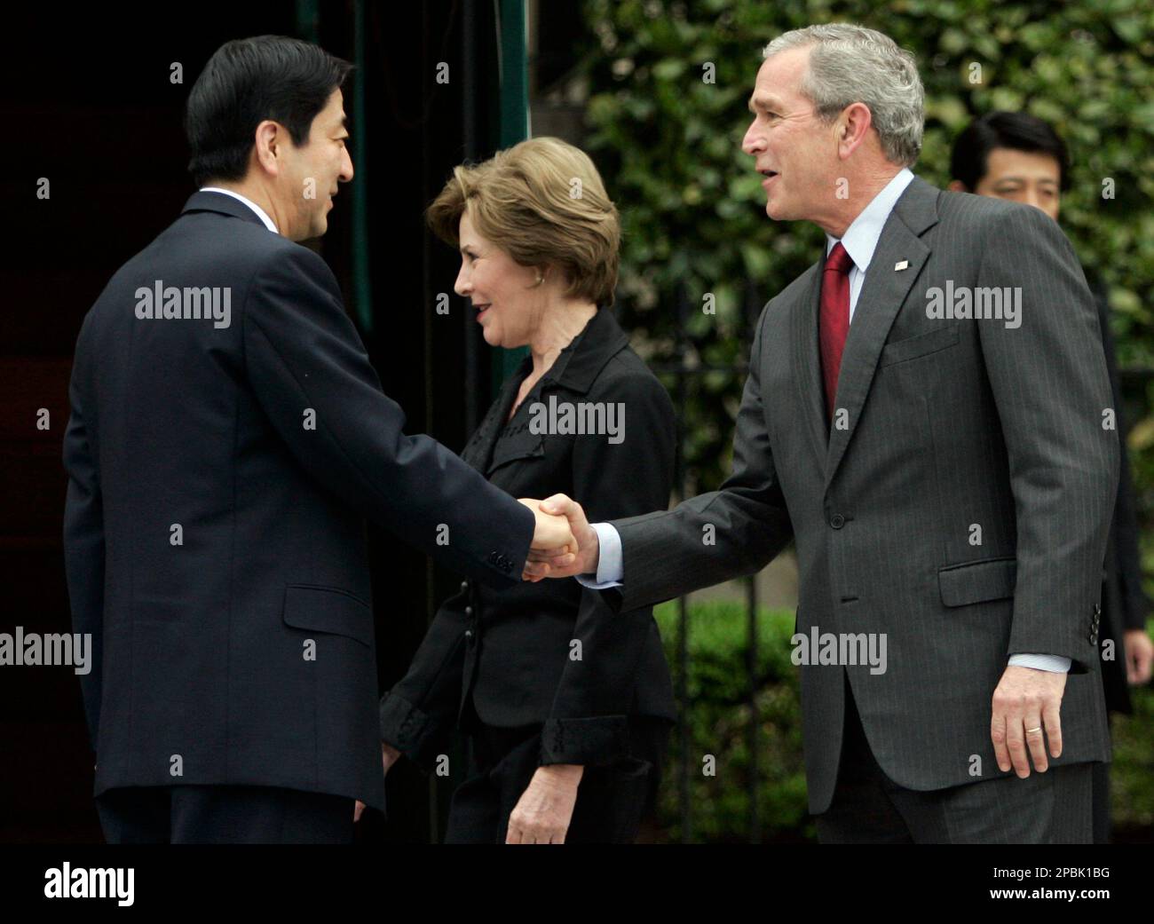 President Bush, right, shakes hands with Japanese Prime Minister Shinzo ...