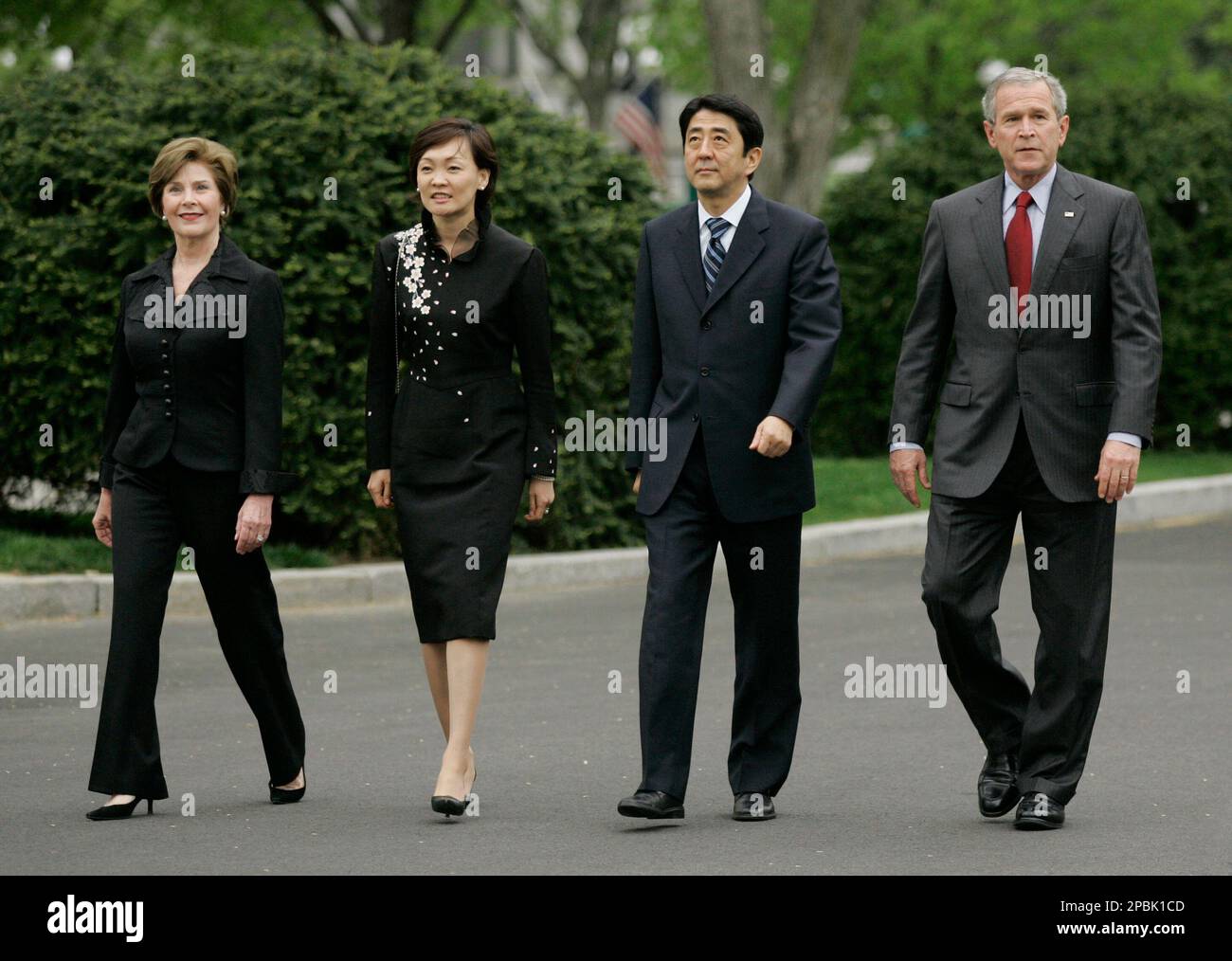 President Bush, right, and first Lady Laura Bush, left, escort Japanese ...