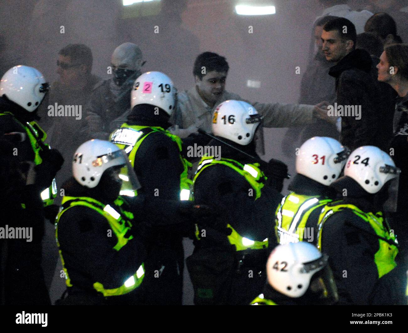 Estonian police in riot gear use tear gas and truncheons as they try to ...