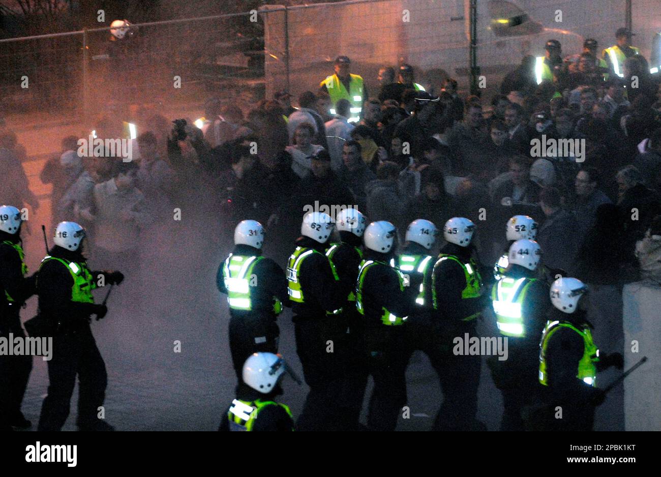 Estonian police in riot gear use tear gas and truncheons as they try to ...