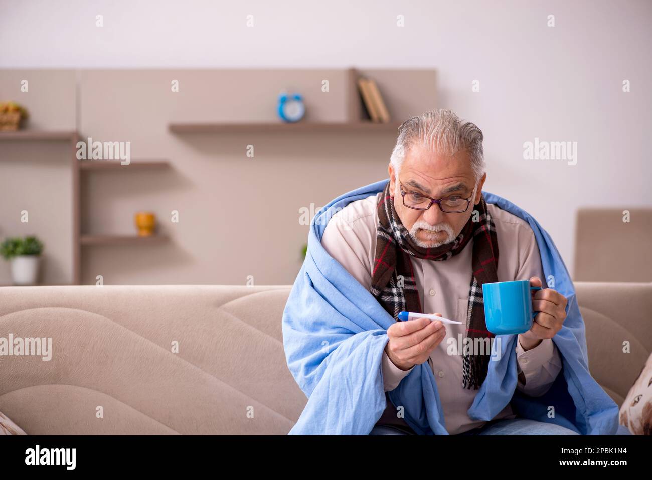 Old man pensioner suffering at home Stock Photo - Alamy
