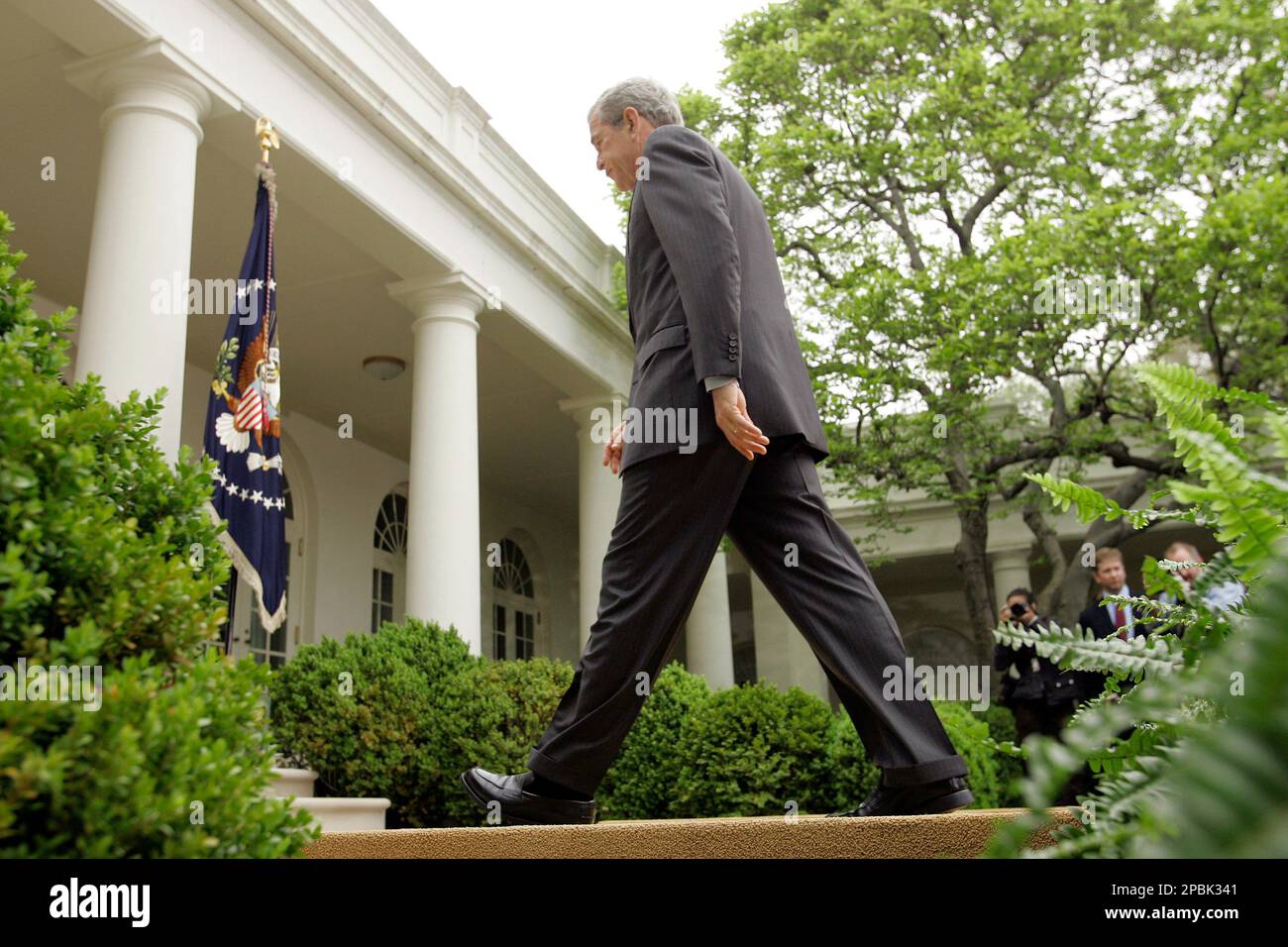 President Bush leaves the Rose Garden of the White House in Washington ...