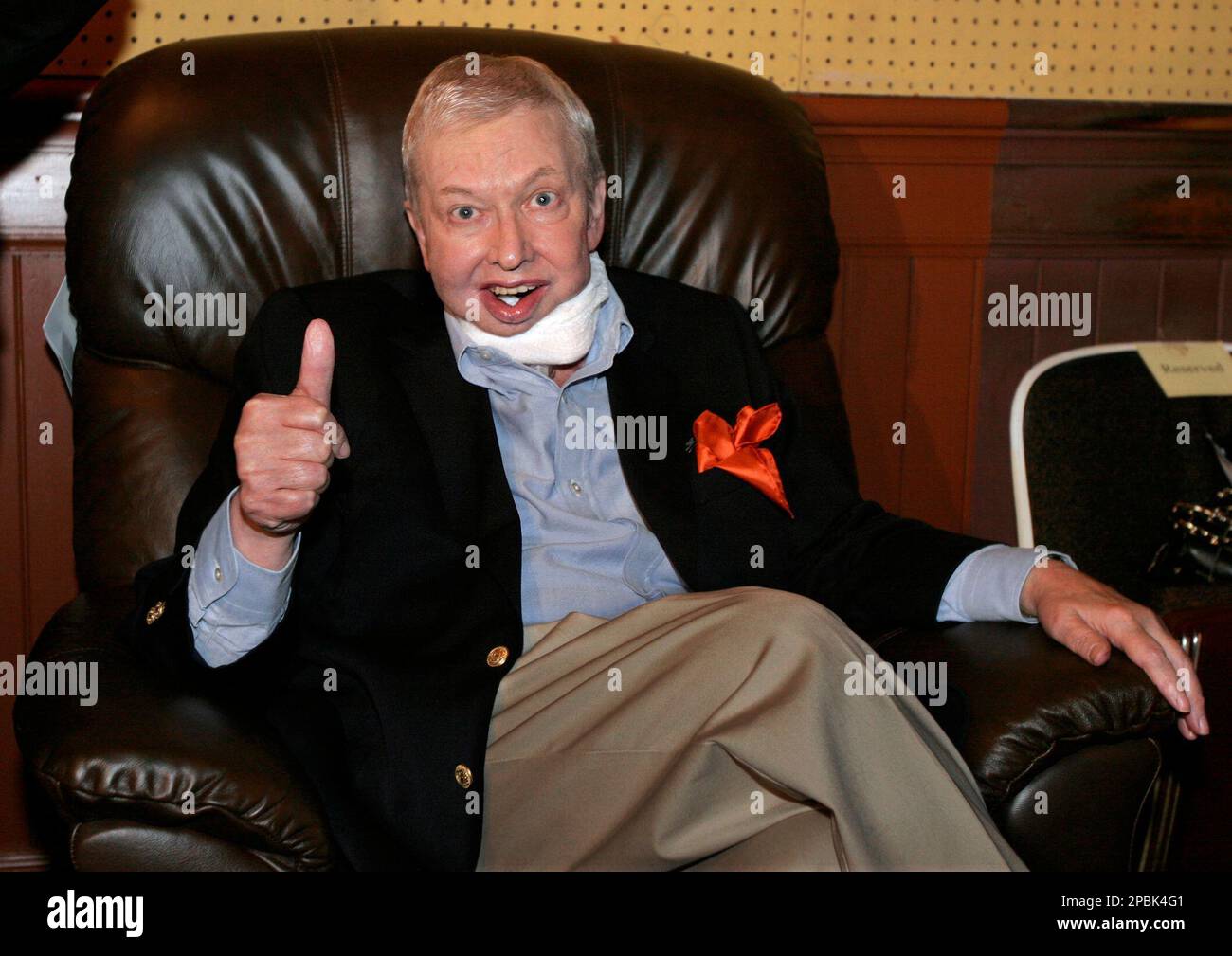 Film critic Roger Ebert acknowledges applause from supporters while ...