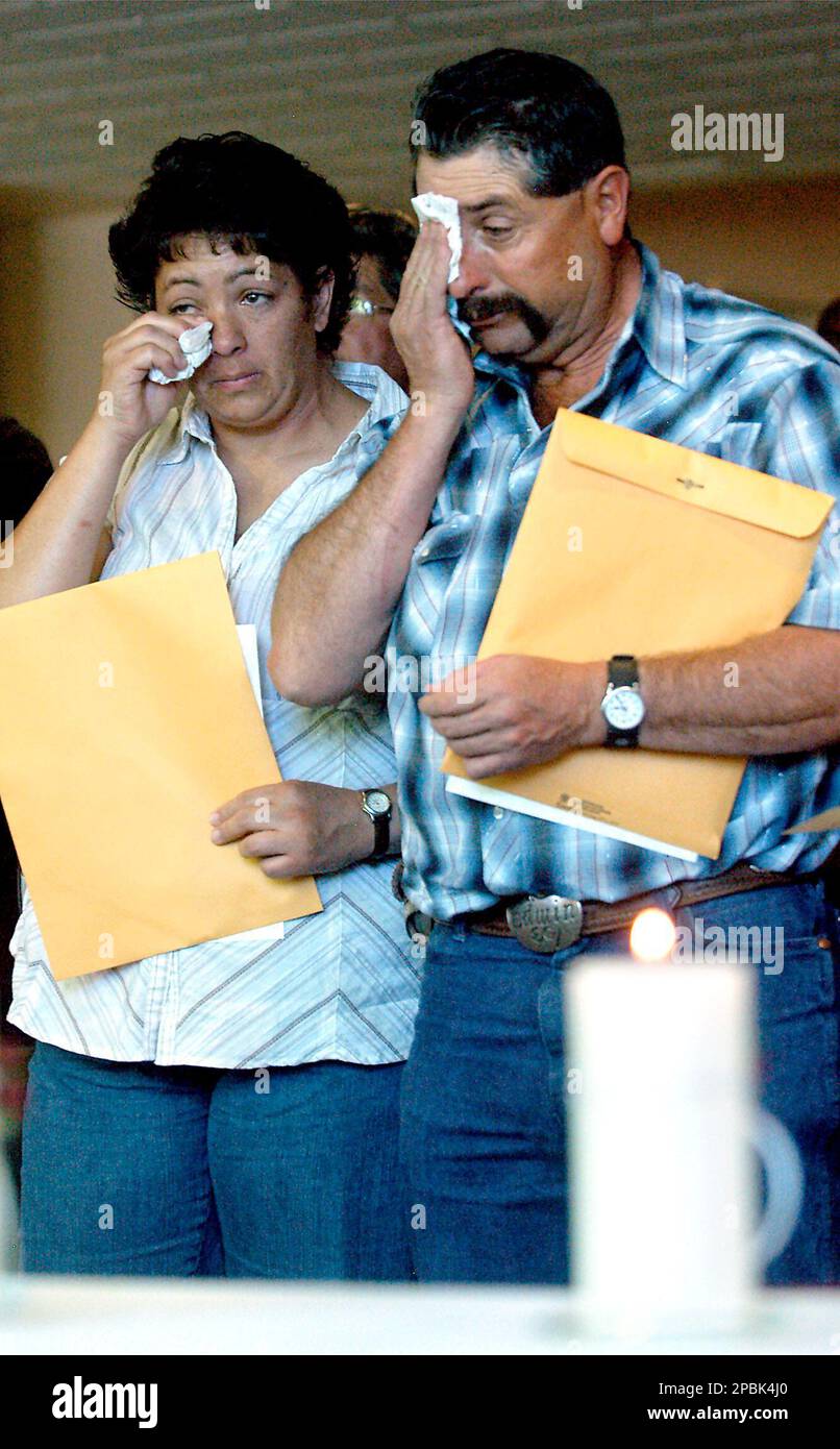 Edwin and Phyllis Gurule, of Tres Piedras, N.M., wipe tears Wednesday ...