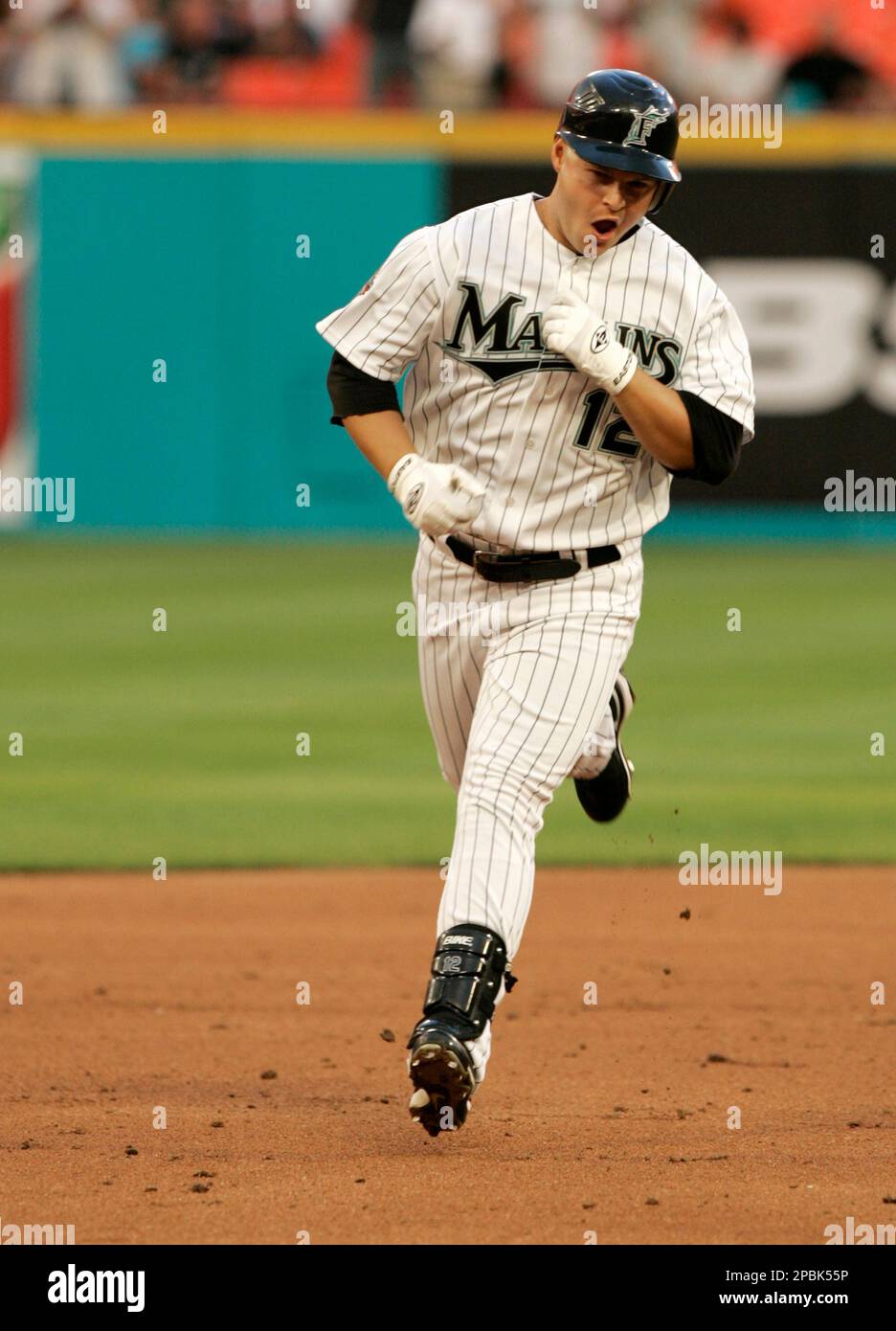 Florida Marlins right fielder Cody Ross runs the bases after hitting a ...
