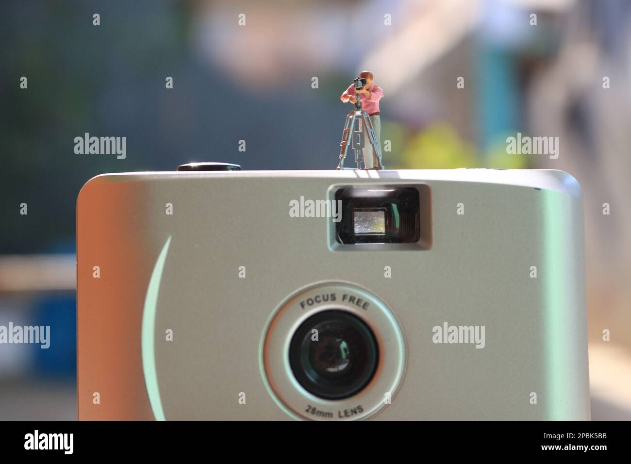 miniature figure of a videographer recording on an analog camera Stock ...