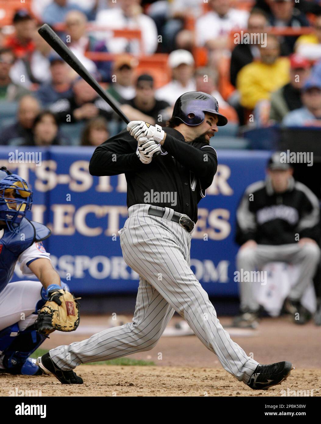 Colorado Rockies' Todd Helton hits a sixth inning double in the Rockies ...