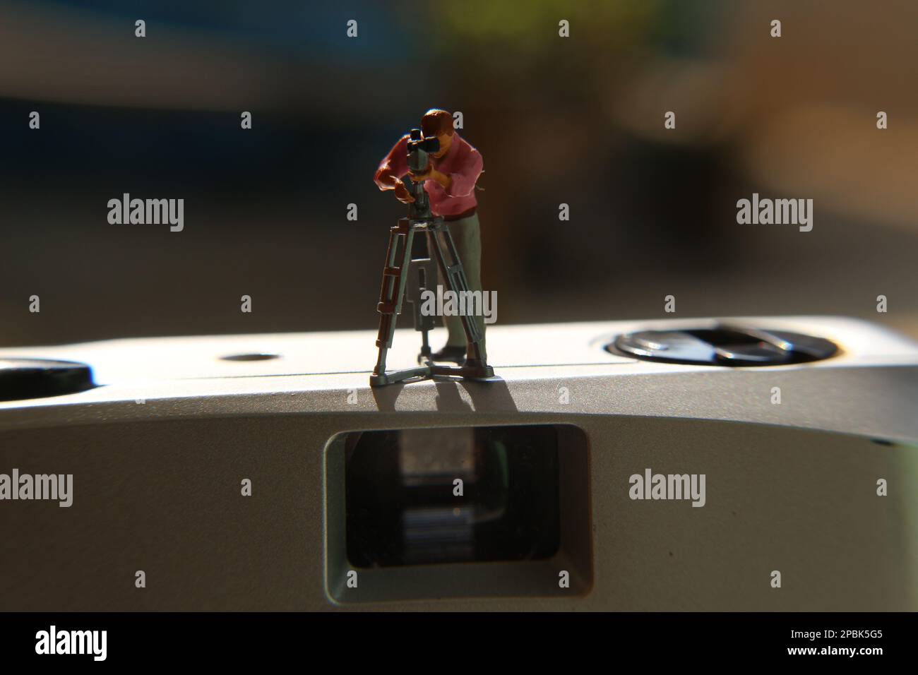 miniature figure of a videographer recording on an analog camera Stock ...