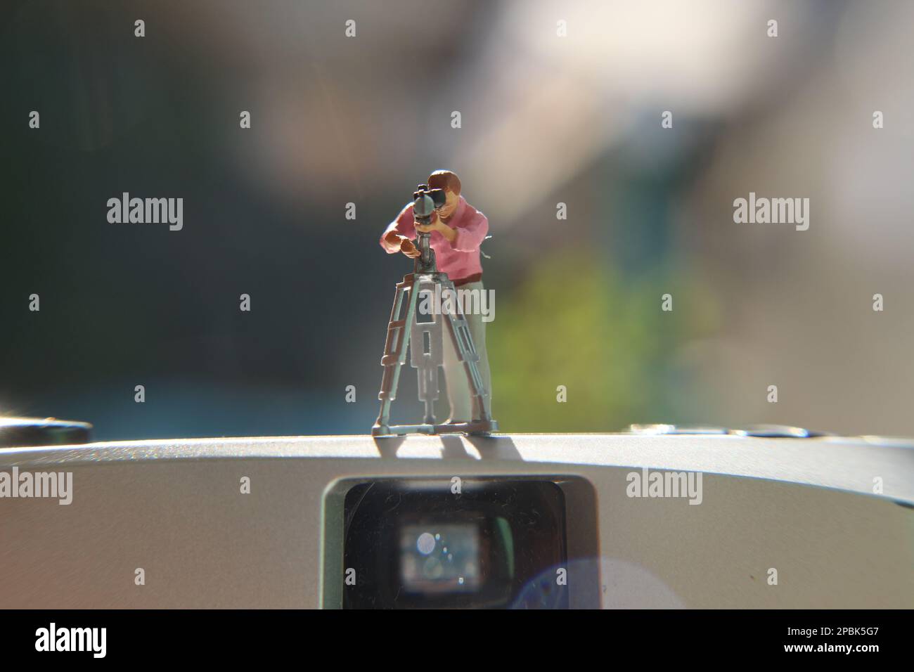 miniature figure of a videographer recording on an analog camera Stock ...