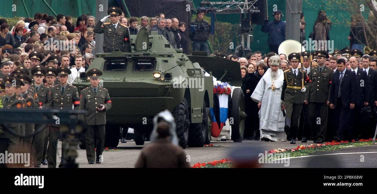 The armored reconnaissance vehicle tows the caisson with the flag ...