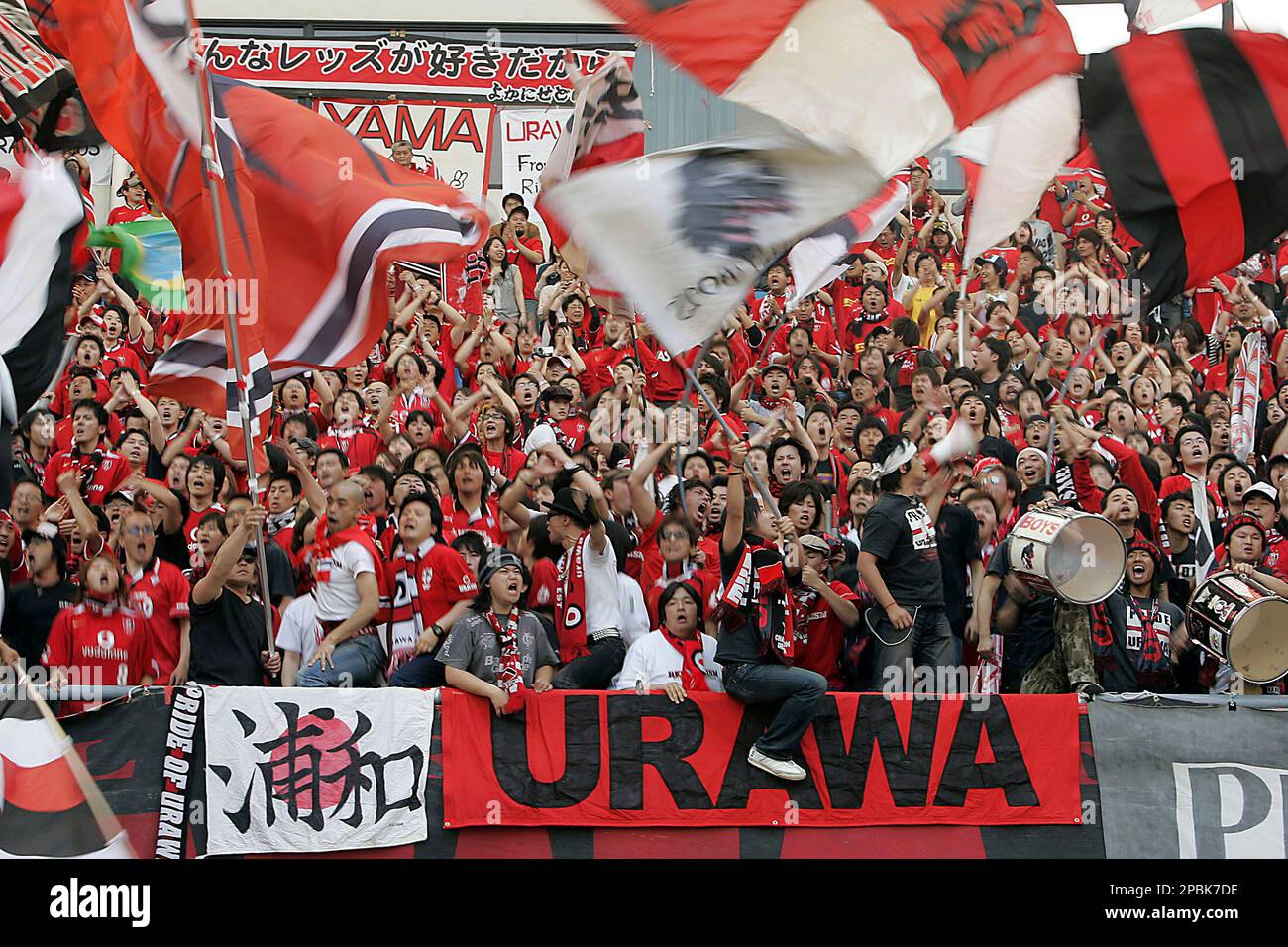Fans of Japan's Urawa Reds cheer their team during their Group E match ...