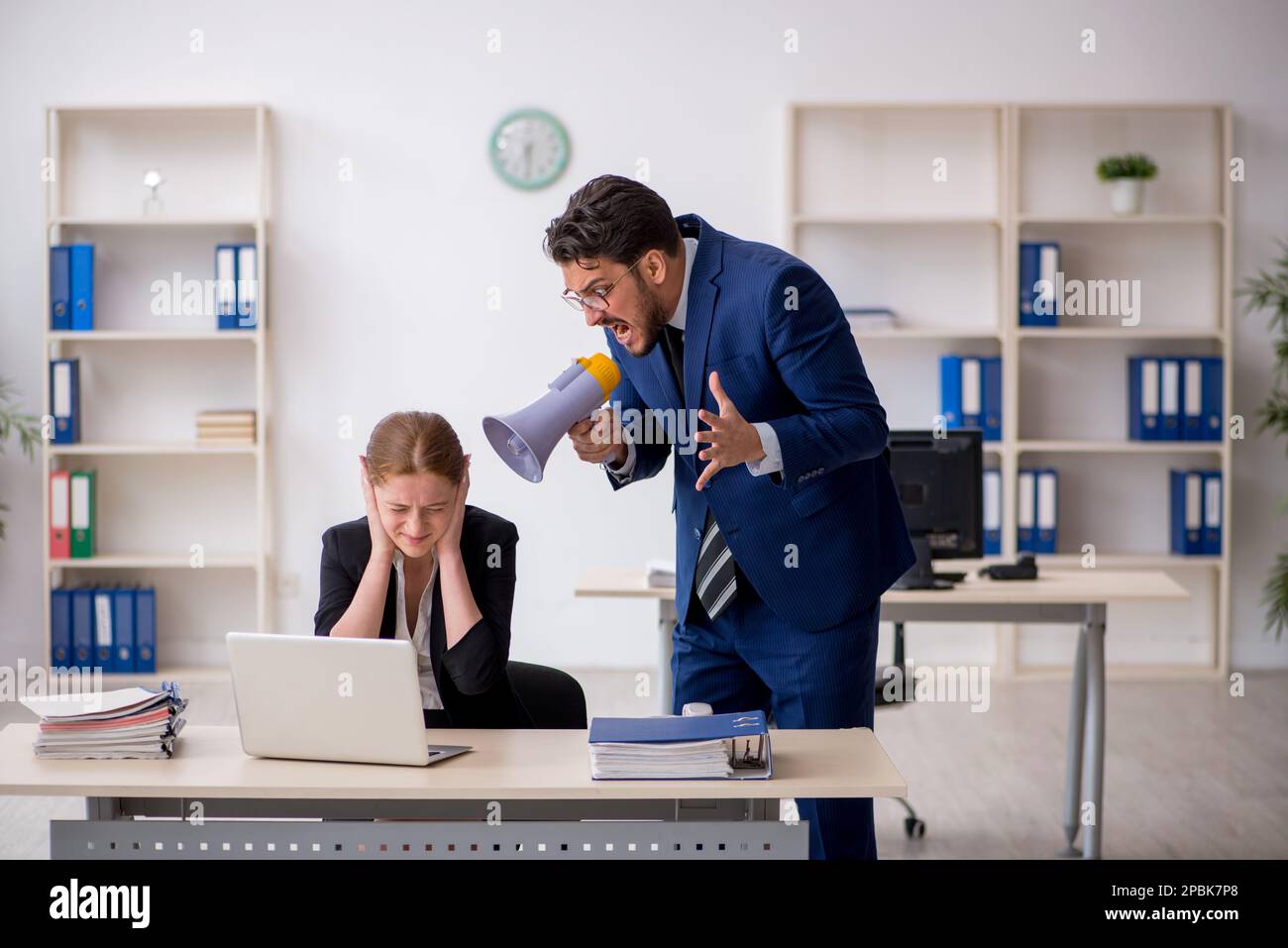 Angry male boss and young female employee at workplace Stock Photo - Alamy