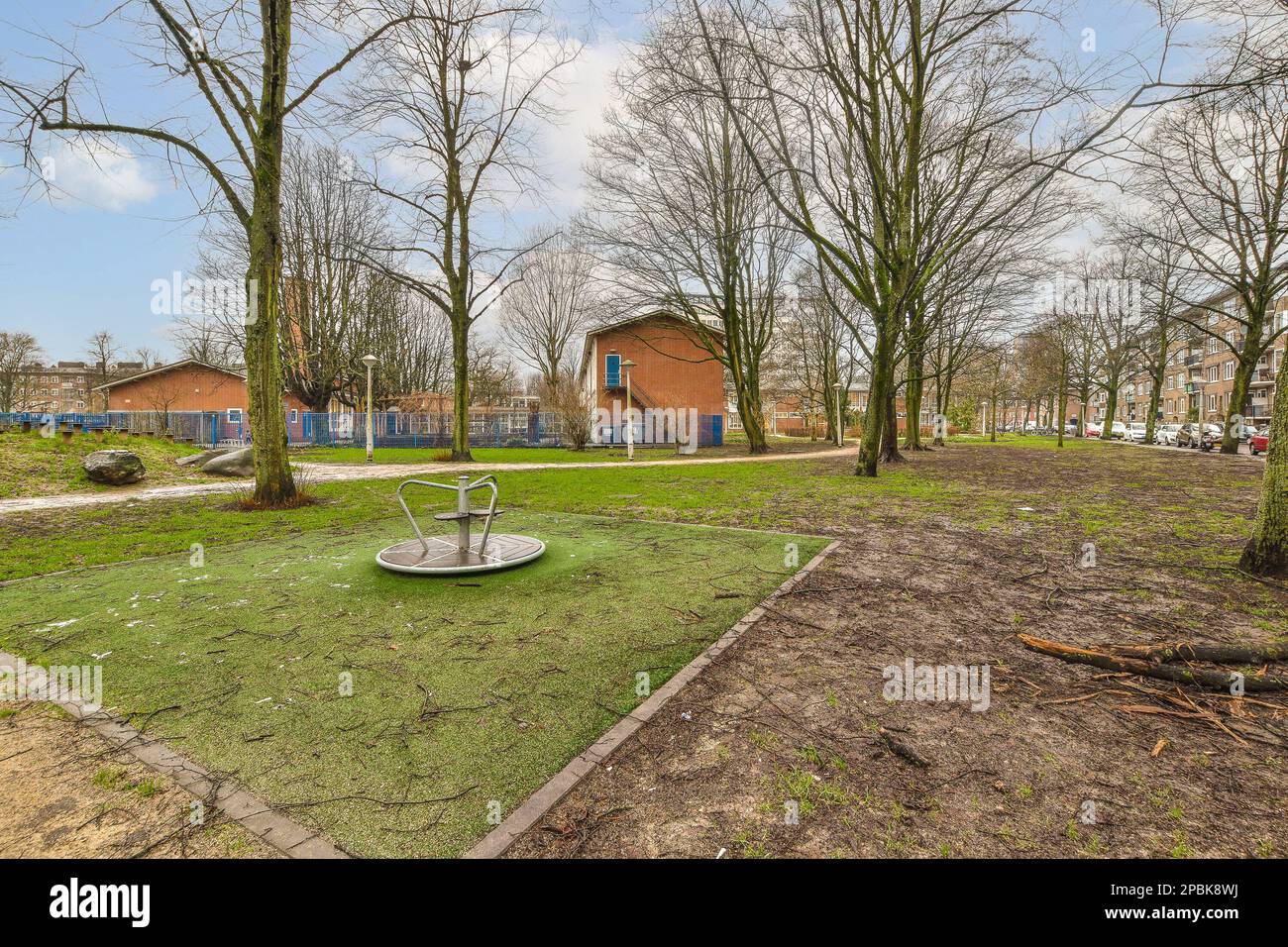 an empty playground in the middle of a residential area, with no people ...