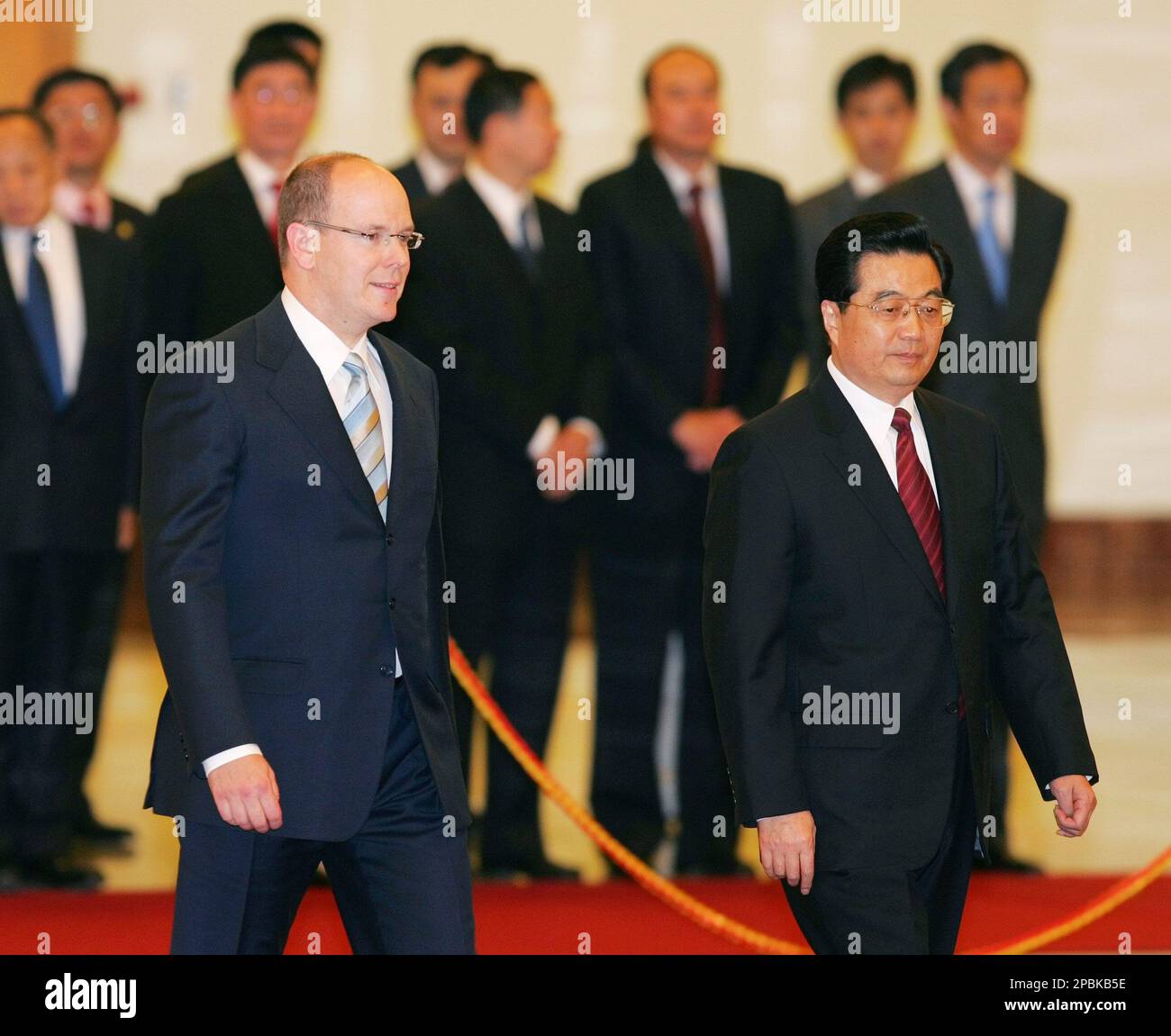 Prince Albert II, of Monaco, left, walks with Chinese President Hu ...