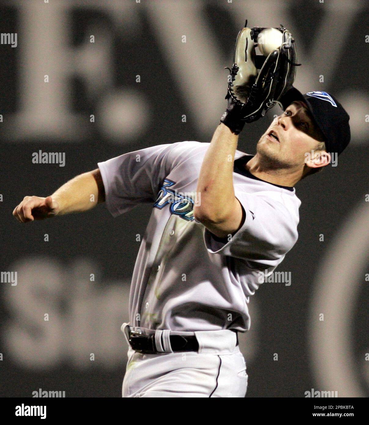 Toronto Blue Jays second baseman Aaron Hill catches a fly ball by ...