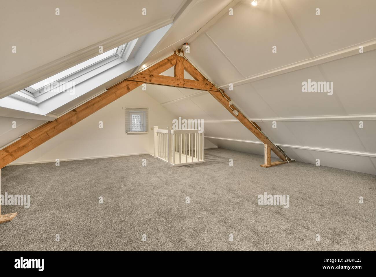 an attic room with carpet and skylights on the roof, showing how it's ...
