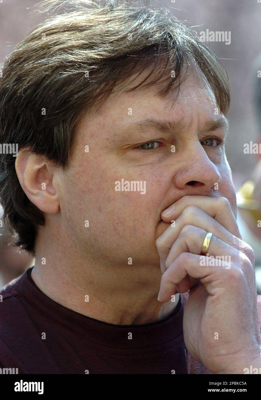 Mark Magnoli stands in the audience after speaking during a ceremony ...
