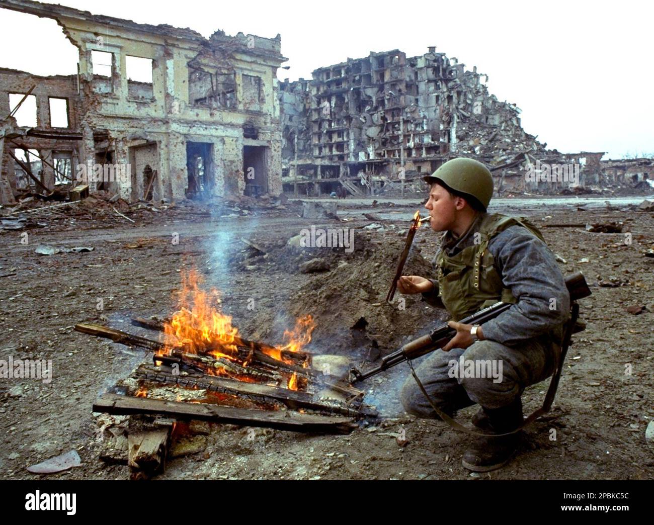 ** FILE ** A Russian soldier lights a cigarette in the Chechen capital ...