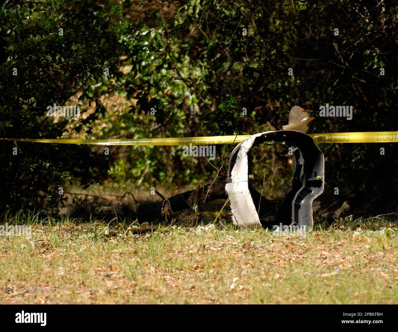 Debris from a Navy Blue Angel jet lies in a wooded area in Burton, S.C ...
