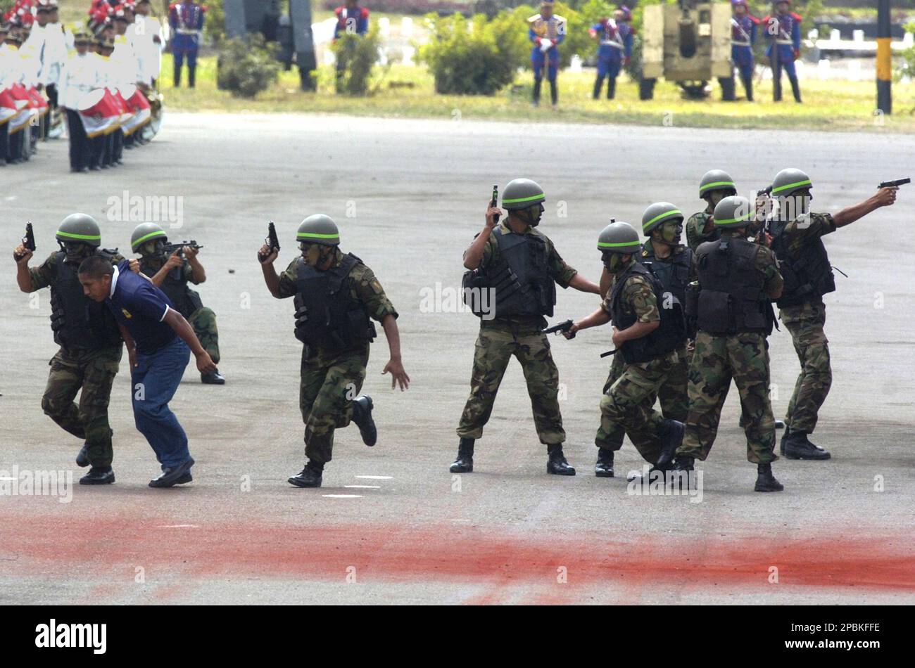Army soldiers simulate a hostage-rescue situation during the 10th ...