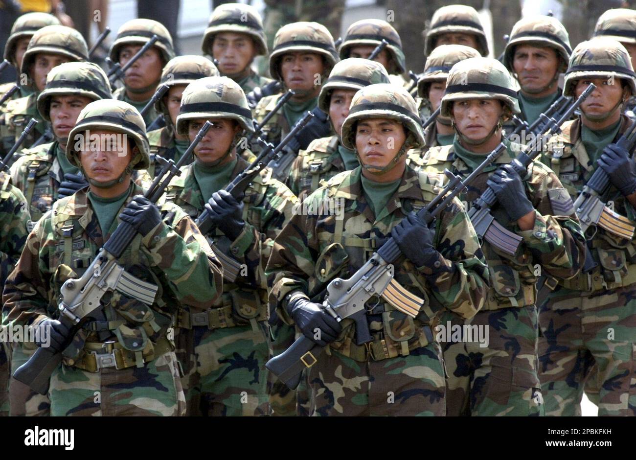 Army soldiers march during the 10th anniversary ceremony of the 1997 ...