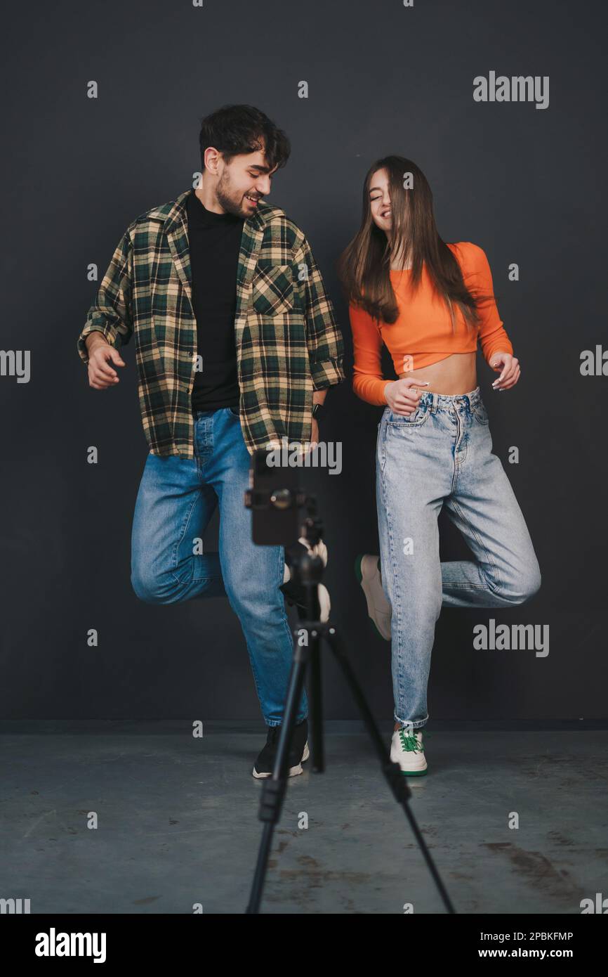 Couple of funny influencers shooting dance video for social network on ...