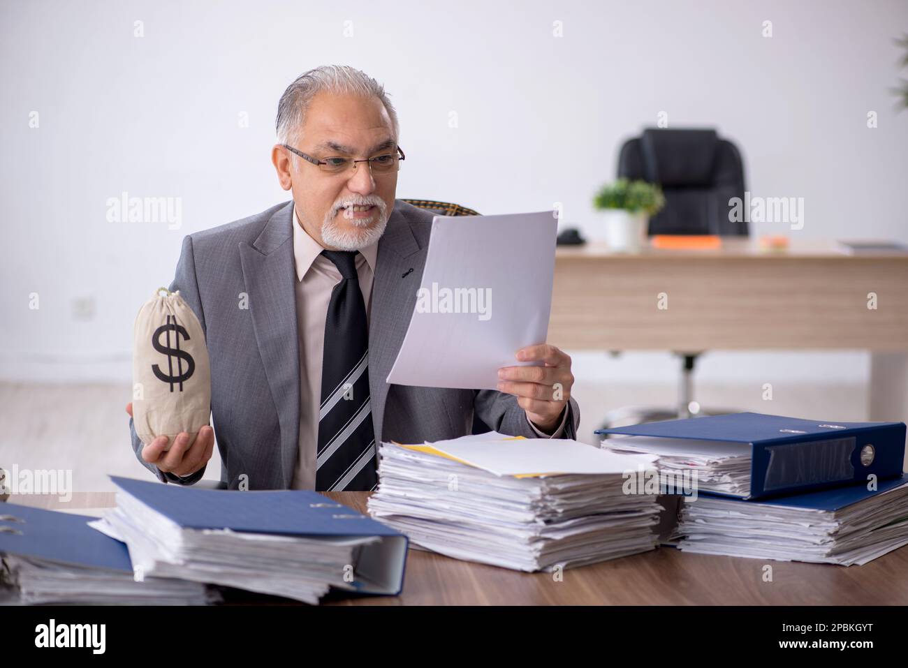 Old male boss in remuneration concept Stock Photo - Alamy