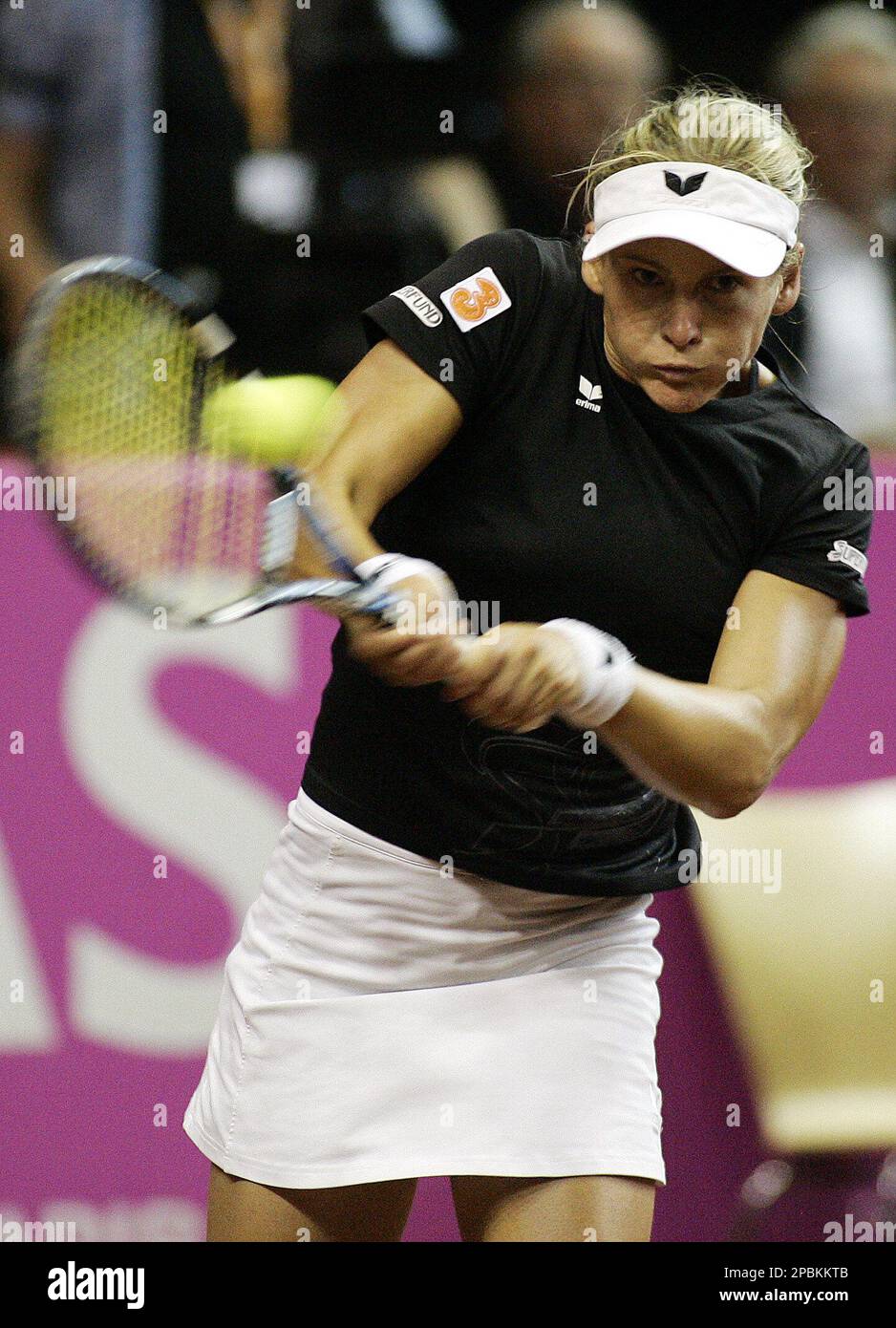 Sybille Bammer from Austria returns a shot to Australia's Alicia Molik ...