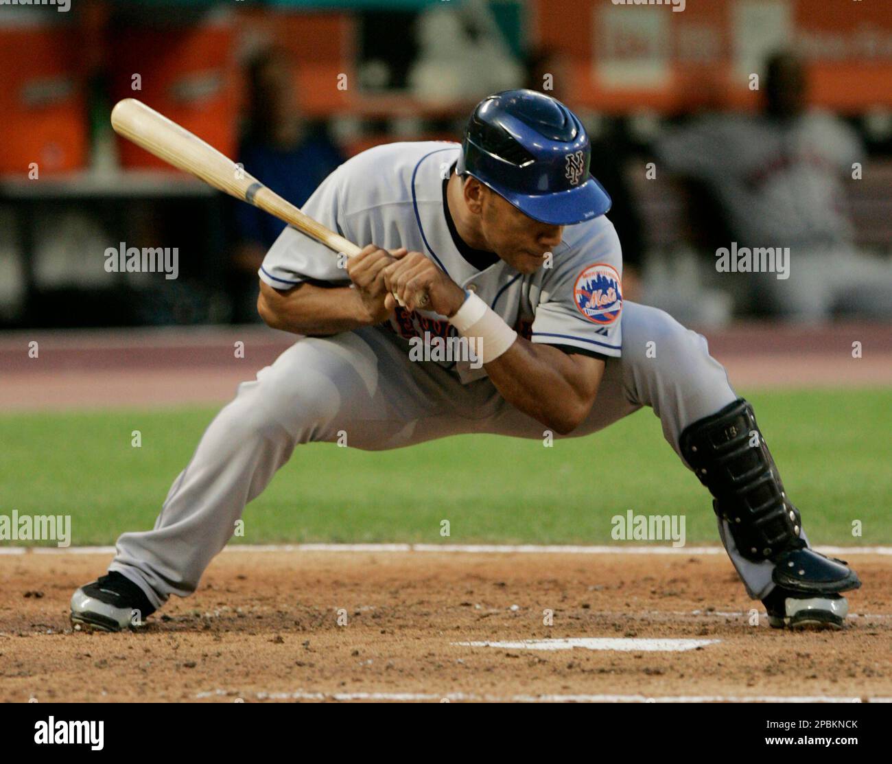 New York Mets left fielder Moises Alou moves away from a close pitch in ...