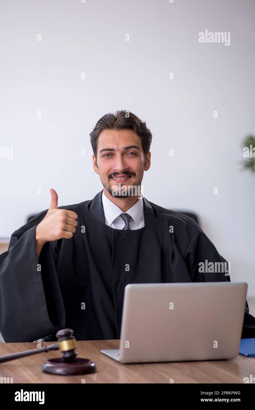 Young judge working in the courthouse Stock Photo - Alamy
