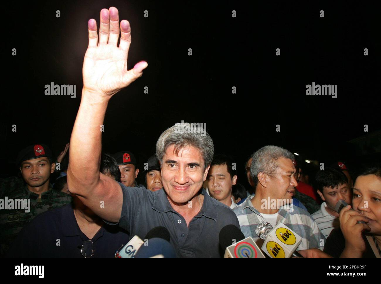 Detained former Senator Gregorio "Gringo" Honasan, waves to supporters ...