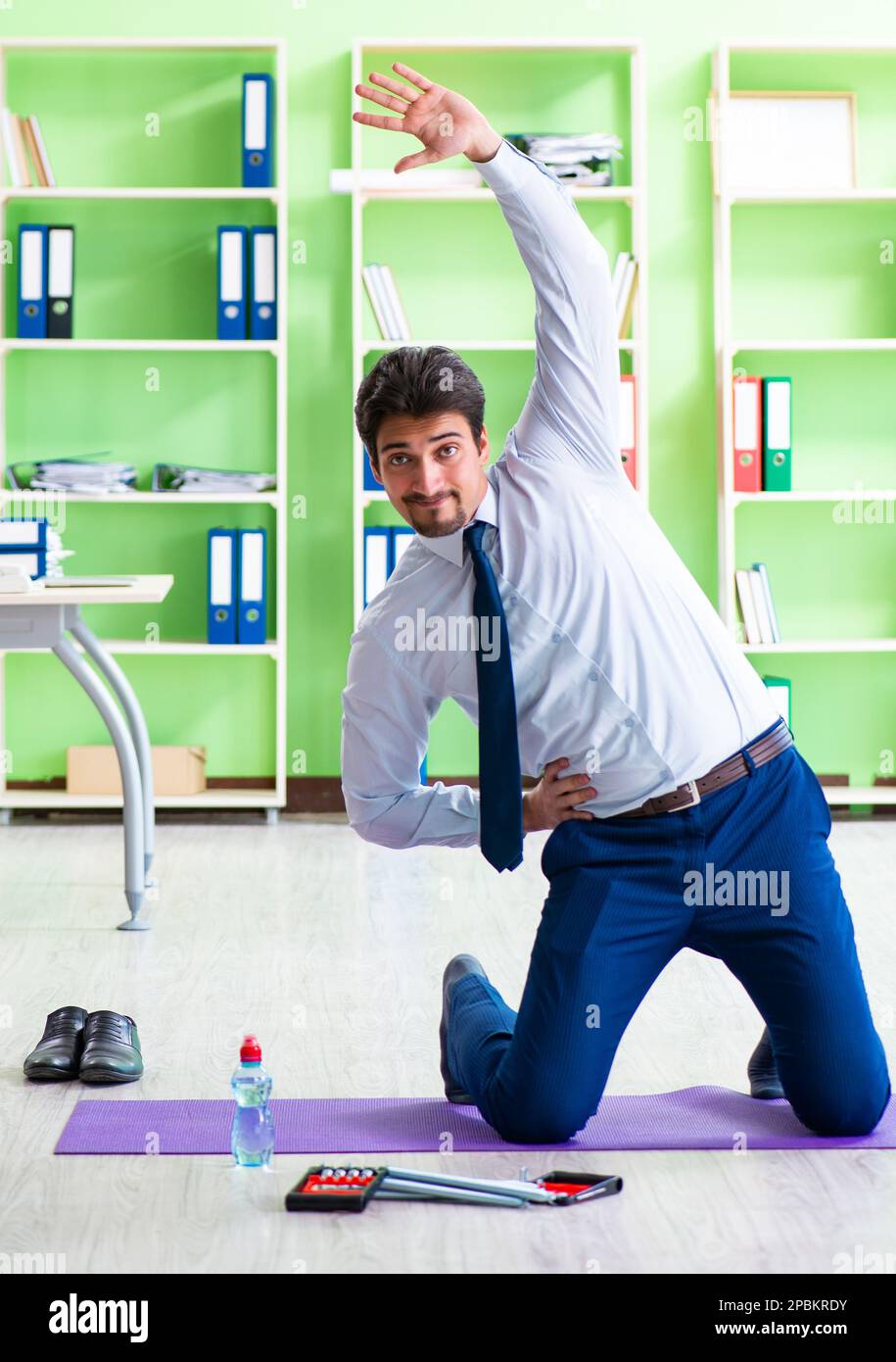 The employee doing exercises during break at work Stock Photo - Alamy