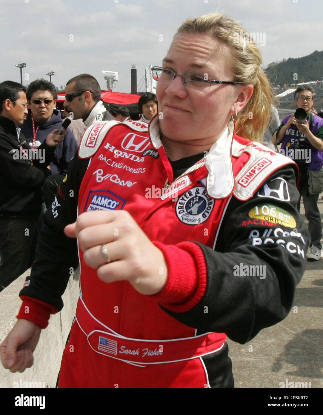 Indy Racing League driver Sarah Fisher of the U.S., chats with her pit ...
