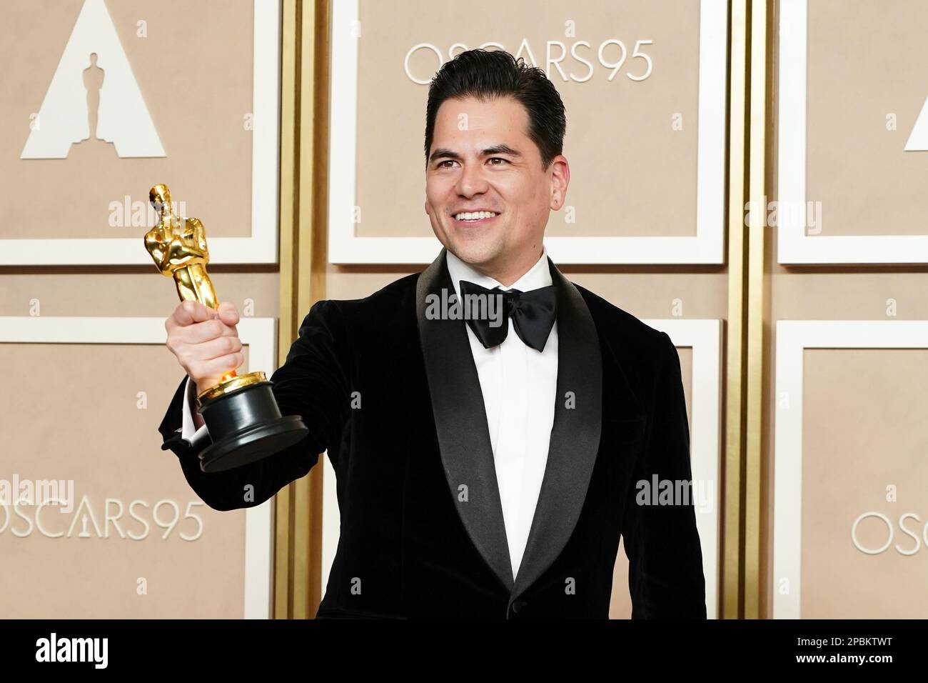 Jonathan Wang poses with the award for best picture for "Everything ...