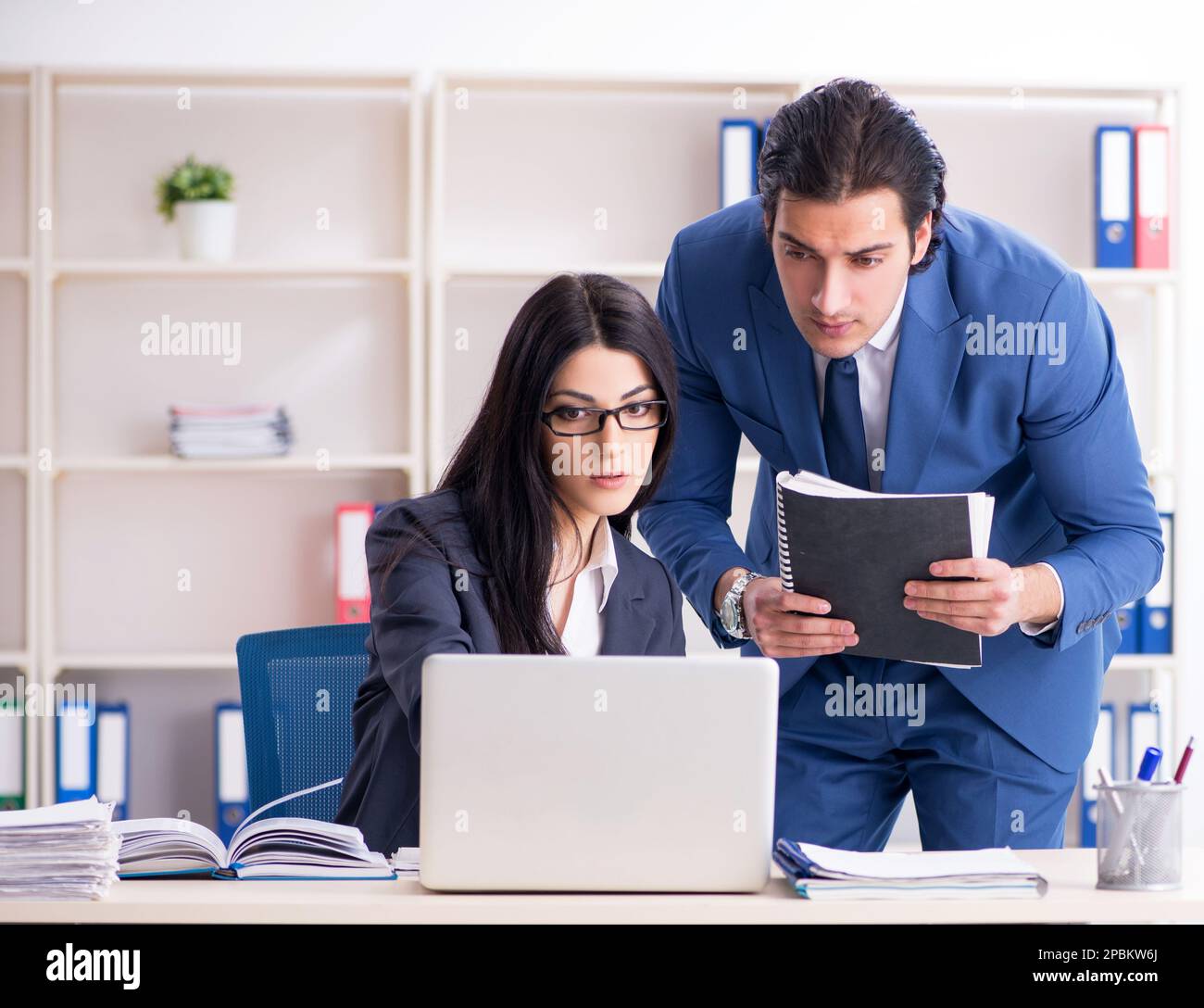 The two employees working in the office Stock Photo - Alamy