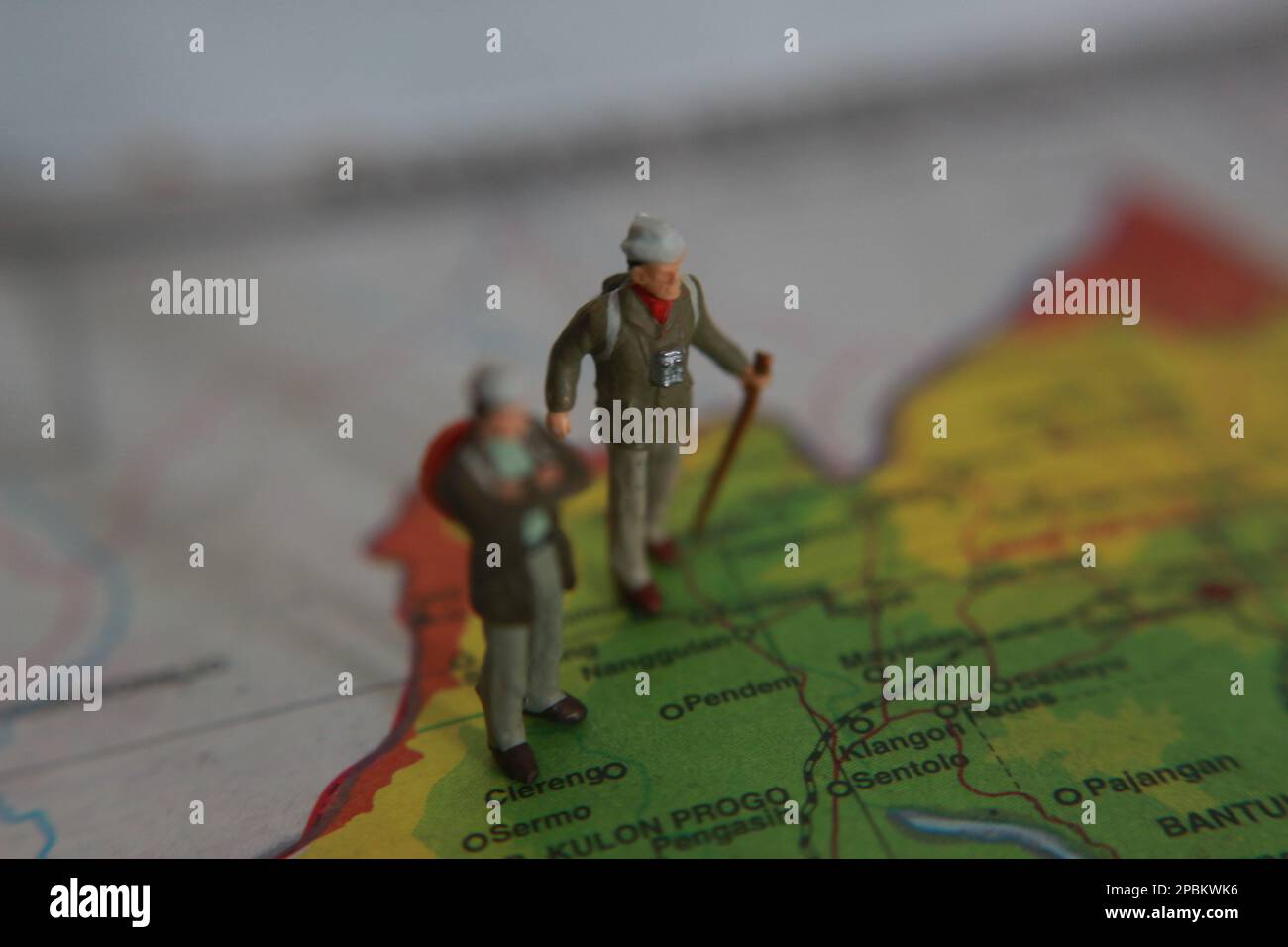 miniature figure of an explorer posing on a map or atlas Stock Photo ...