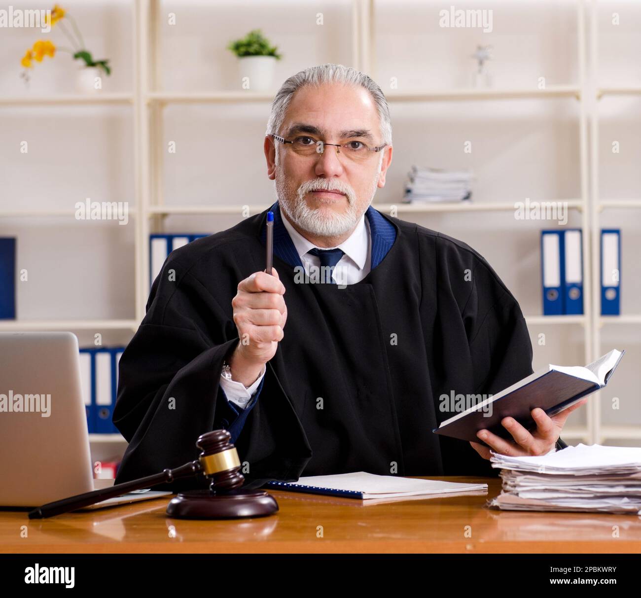 The aged lawyer working in the courthouse Stock Photo - Alamy