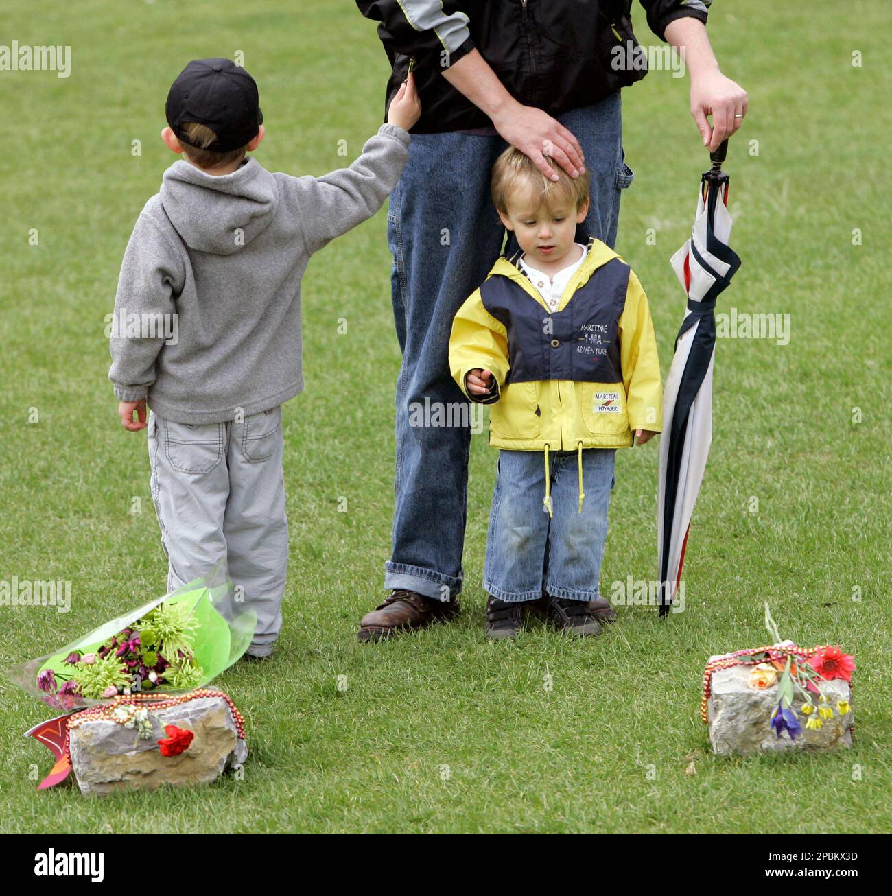 Elliot Shadle, left, and his brother Alden, front, stand with their ...