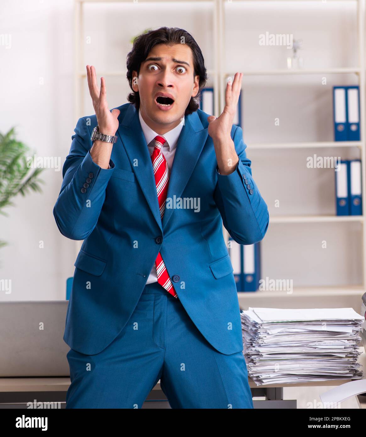 The young employee making copies at copying machine Stock Photo - Alamy