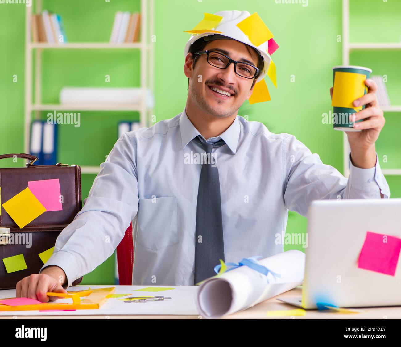 Male engineer working on new project with many conflicting priorities ...