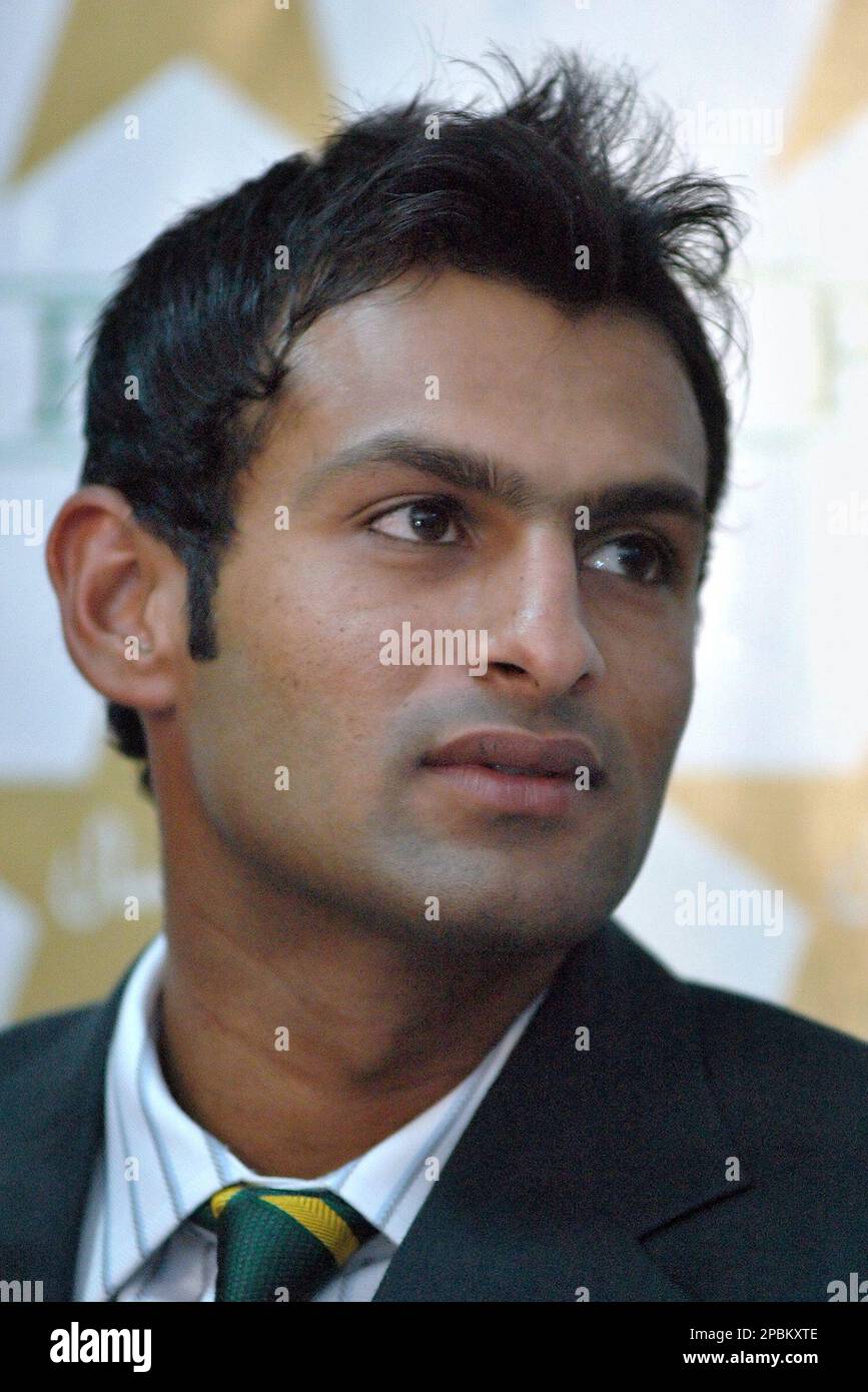 Newly appointed skipper of Pakistani cricket team Shoaib Malik listens ...
