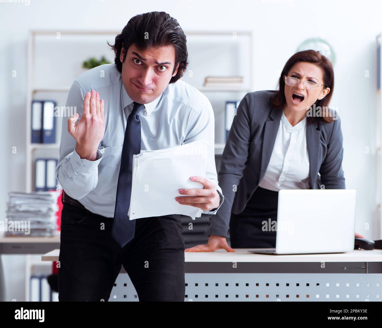Old female boss and young male employee in the off hi-res stock ...