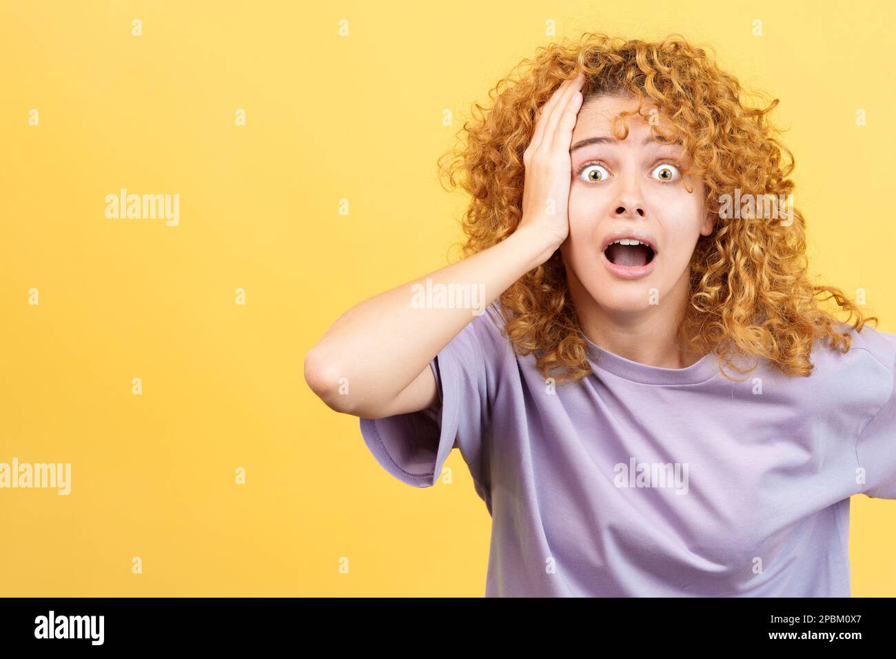 Woman expressing surprise curly hair hi-res stock photography and ...