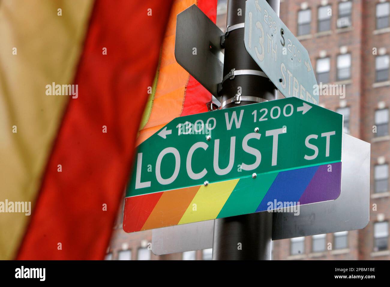 A street sign with a rainbow flag in Philadelphia, is shown Wednesday ...