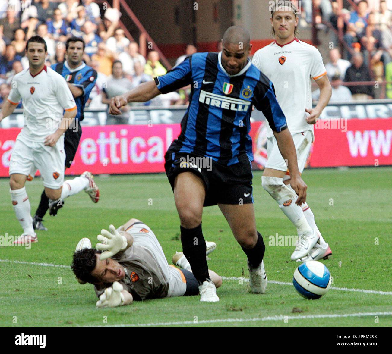 Inter Milan forward Adriano of Brazil, right, is fouled by AS Roma ...