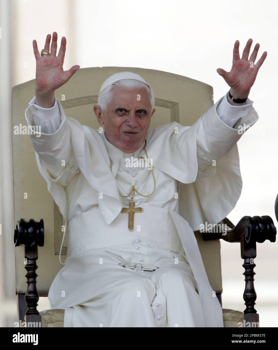 Pope Benedict XVI acknowledges the crowd during his weekly general ...