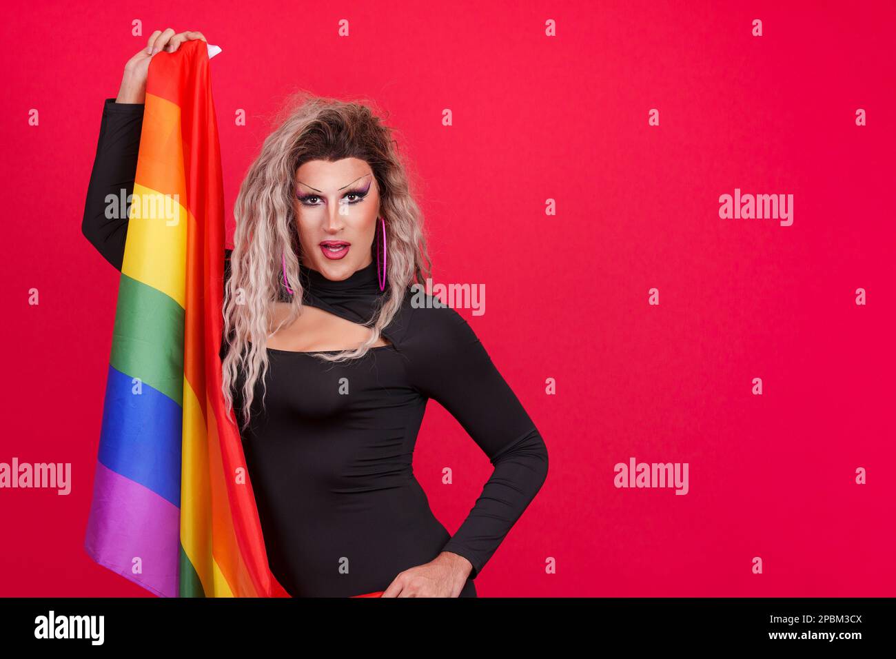 Transgender person with a rainbow lgbt flag Stock Photo - Alamy