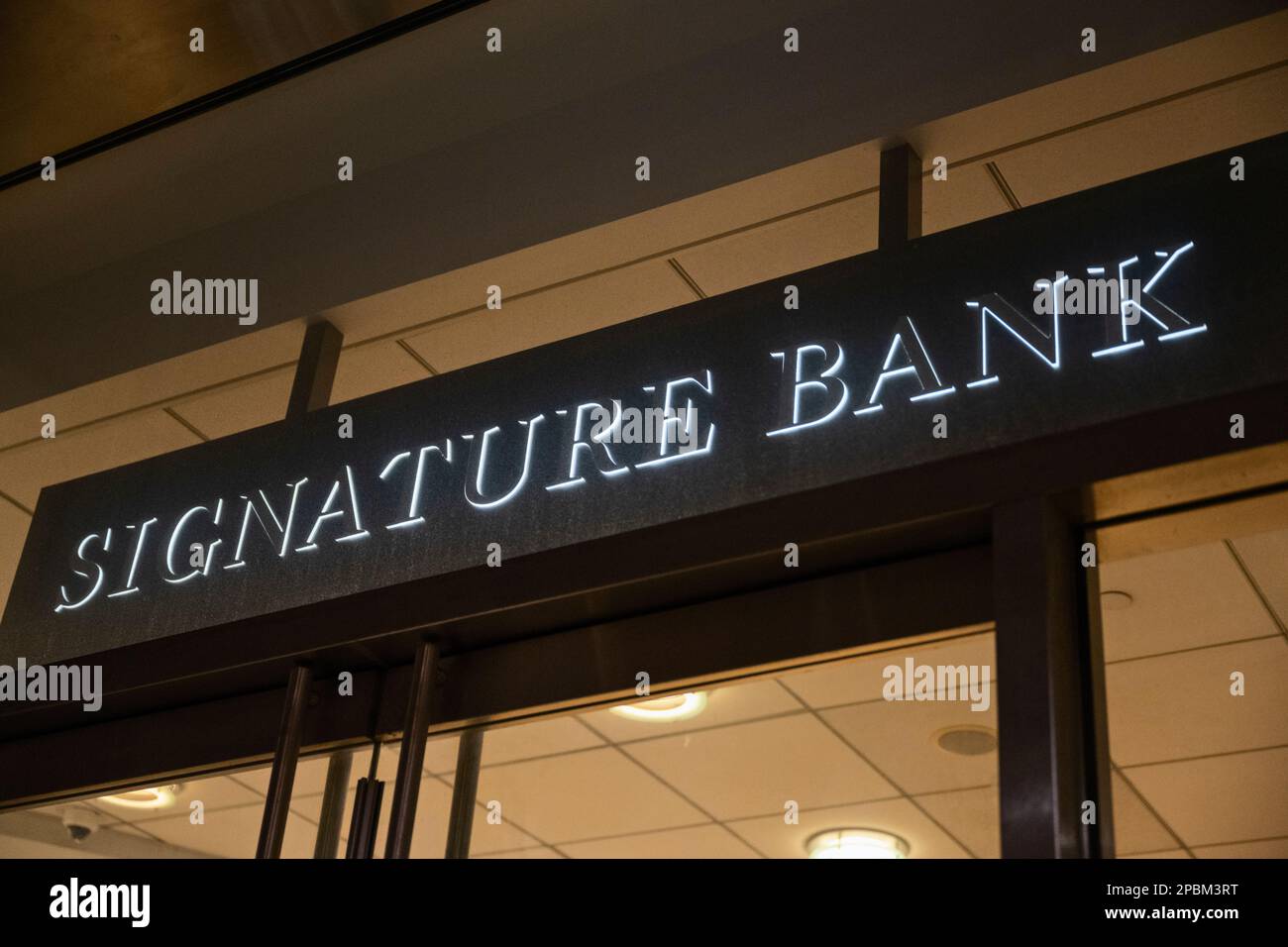 New York, New York, USA. 12 Mar 2023. Signature Bank sign above door to ...
