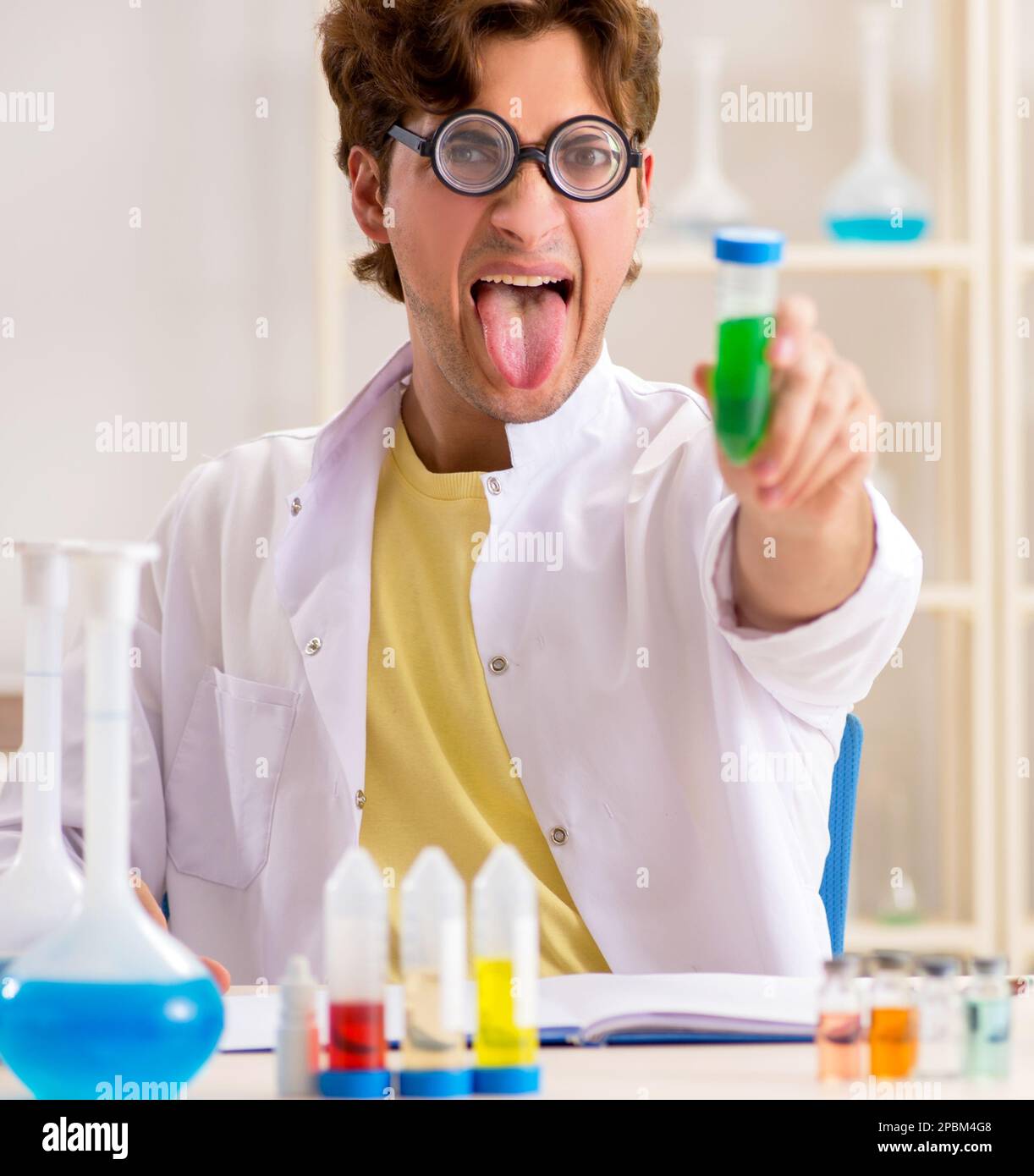 Funny crazy chemist doing experiments and tests Stock Photo - Alamy